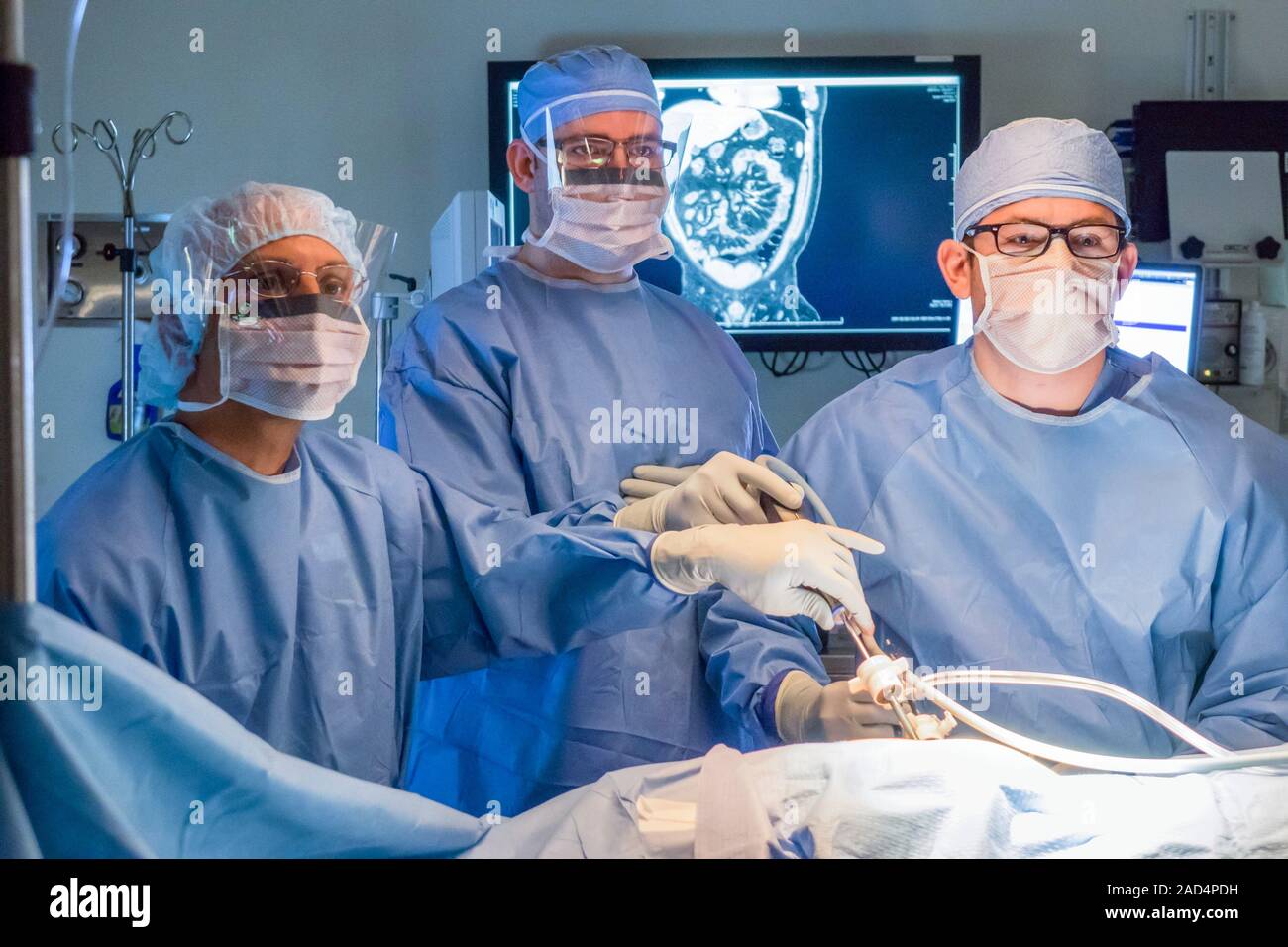 Appendix removal surgery. Surgeon teaching surgical residents during ... Appendix removal surgery. Surgeon teaching surgical residents during ...