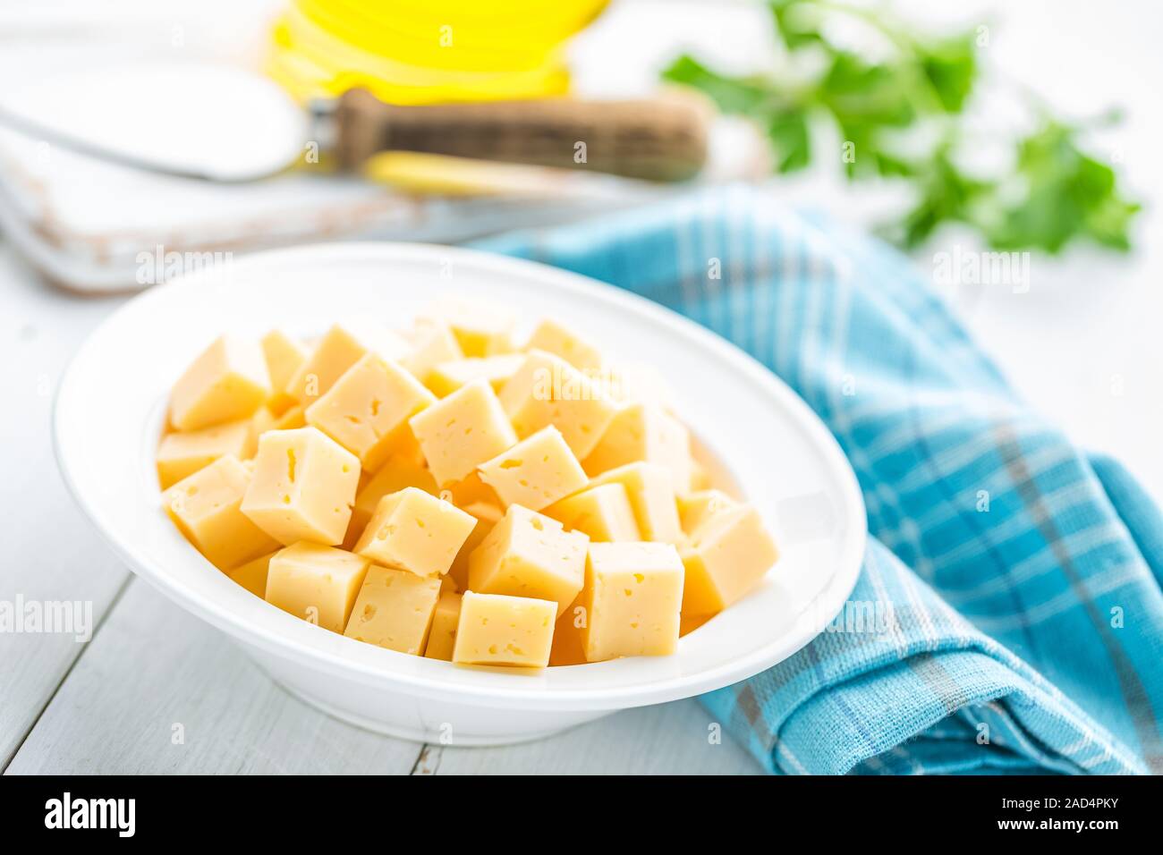 Cheese slices on plate, white background Stock Photo - Alamy