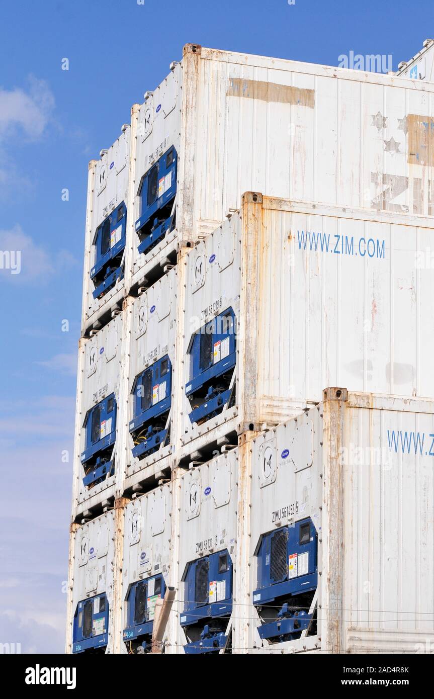 A stack of white shipping containers on blue sky background Stock Photo ...