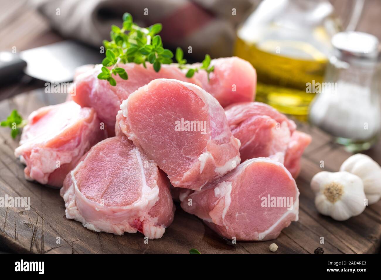 Raw meat, fillet, tenderloin on wooden background Stock Photo - Alamy