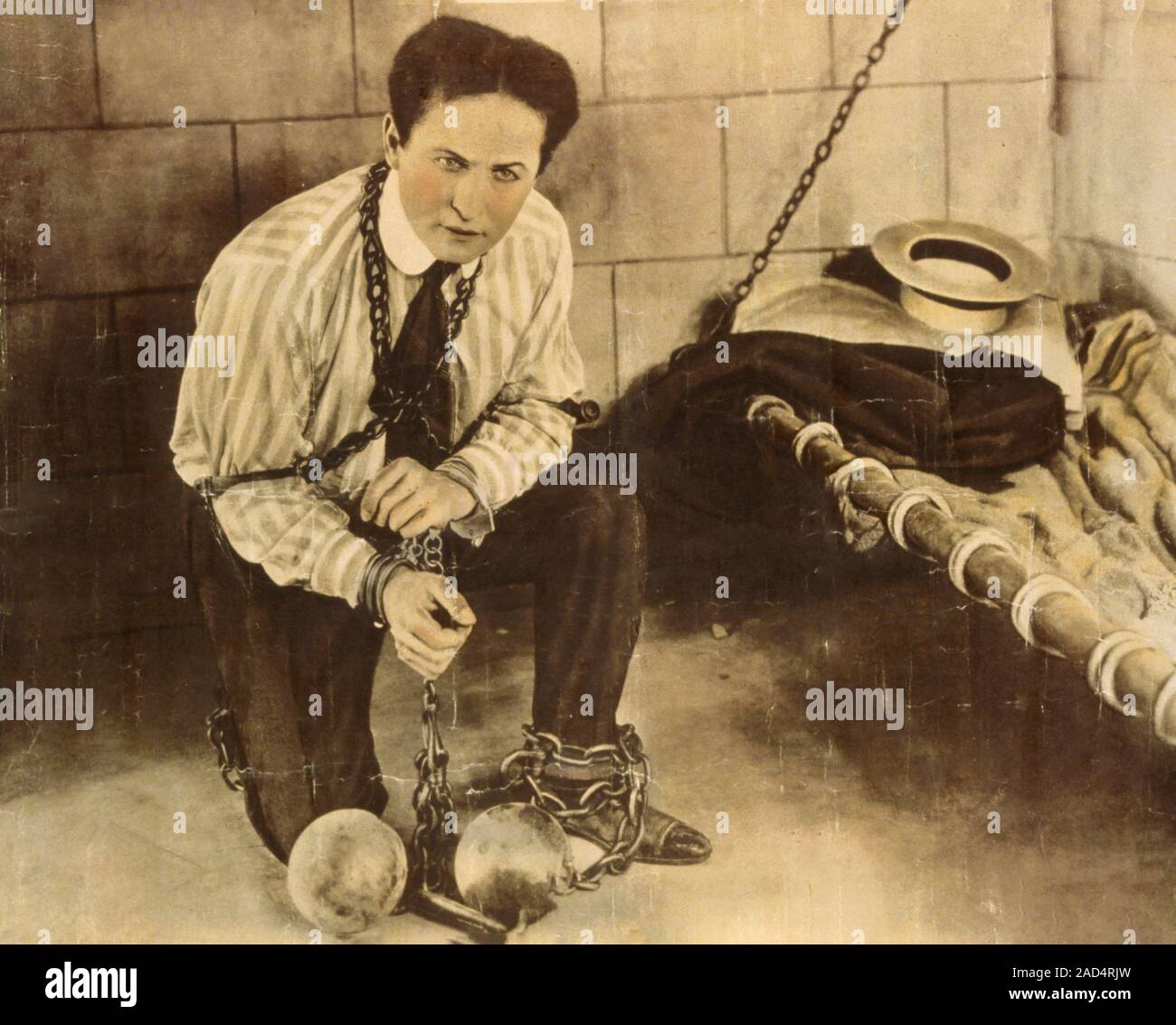 Harry Houdini (1874-1926), Hungarian-born US stunt performer, in chains ...