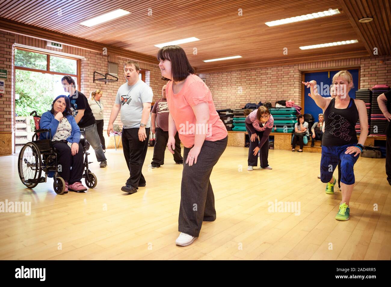 Exercise class for disabled people. Group of people with physical and ...