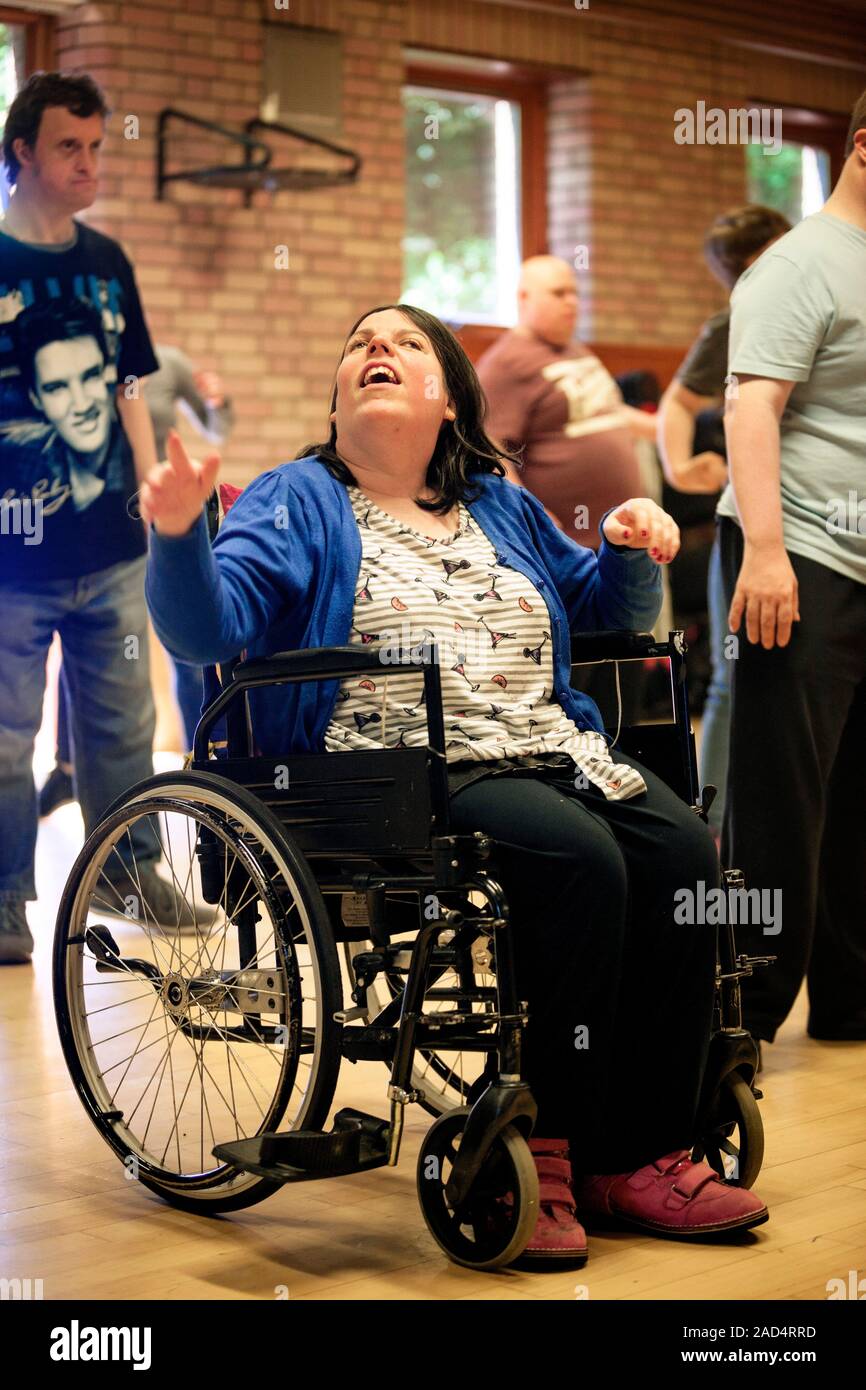 Exercise class for disabled people. Group of people with physical and ...