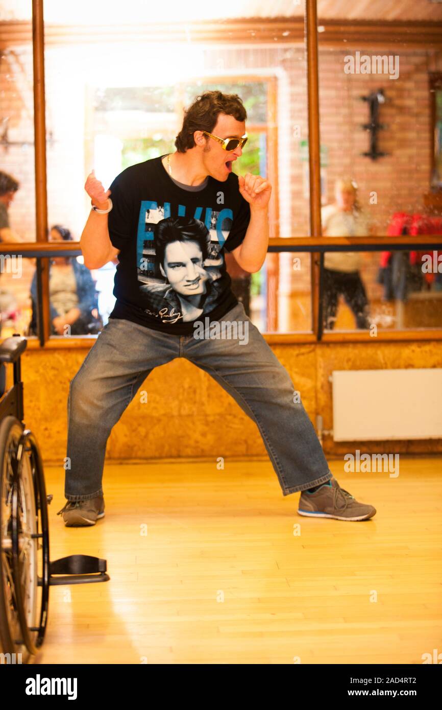 Disabled person at an exercise class. This exercise class is a Zumba ...