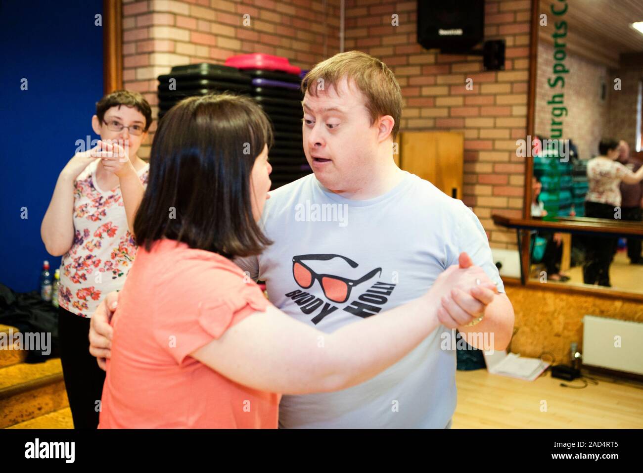 Disabled people dancing at exercise class. This exercise class is a ...