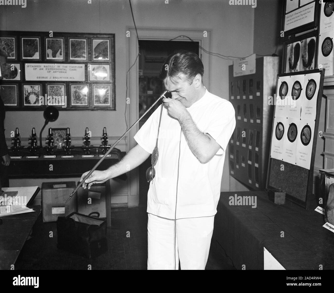 Endoscopy medical laboratory. Medical researcher peering down an ...