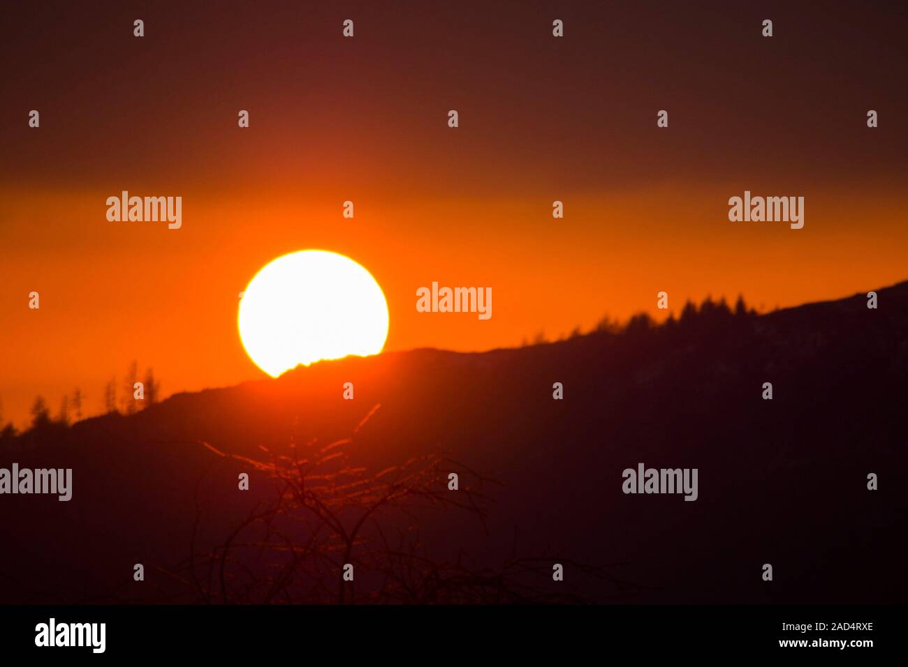 The sun setting over Black Crag in the Lake District, UK Stock Photo ...