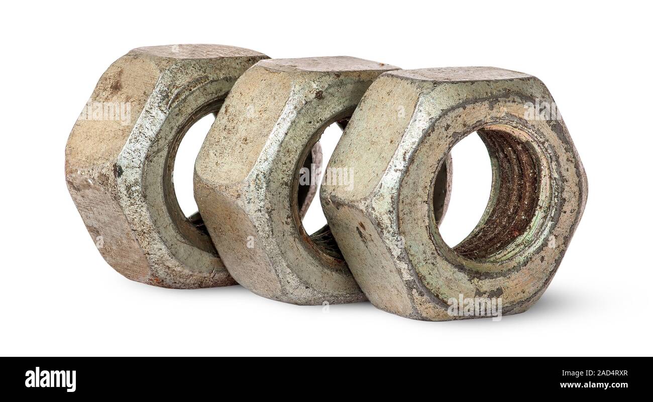 Three old rusty nuts in a row rotated Stock Photo - Alamy