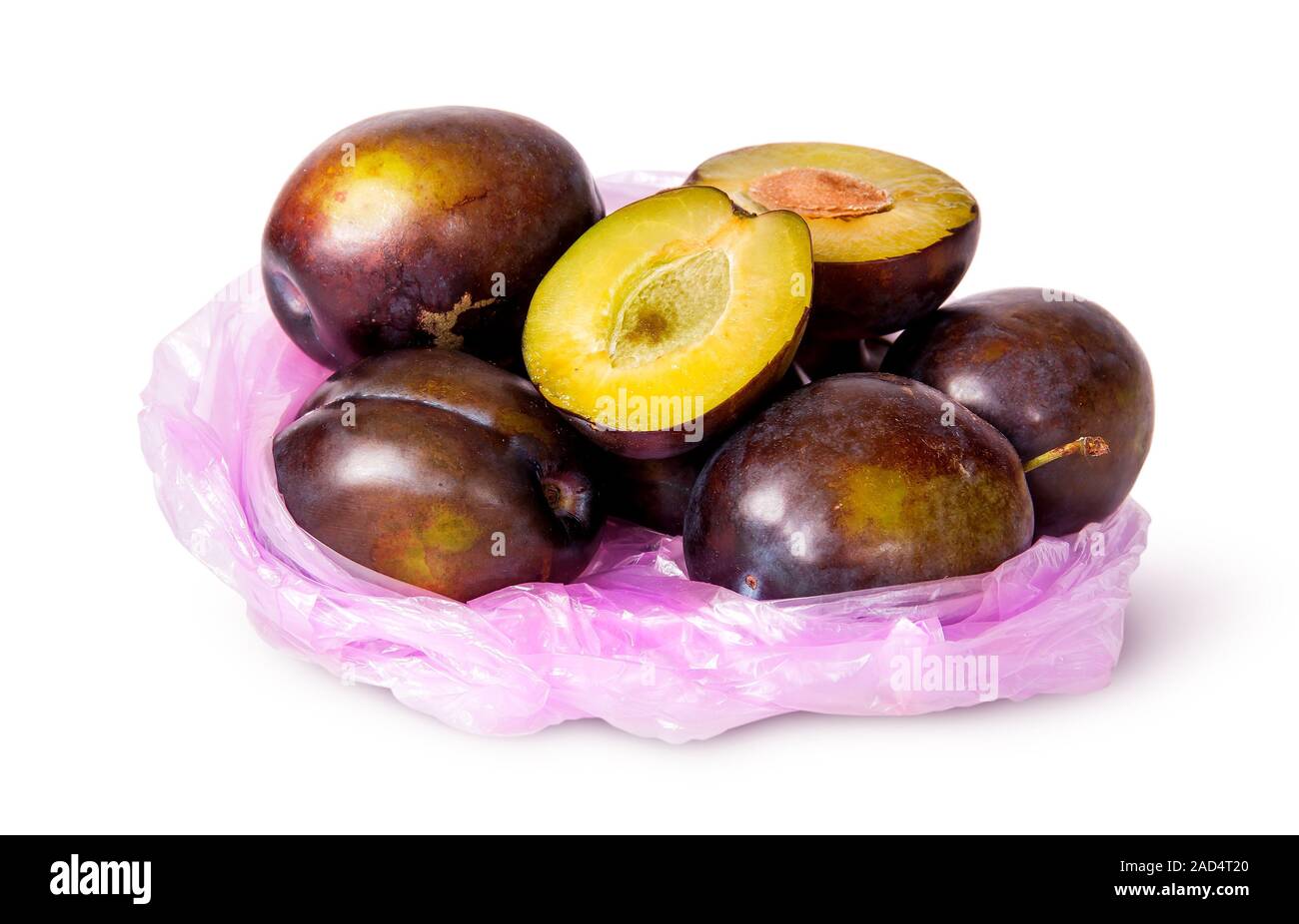 Whole and half violet plums in plastic bag Stock Photo - Alamy