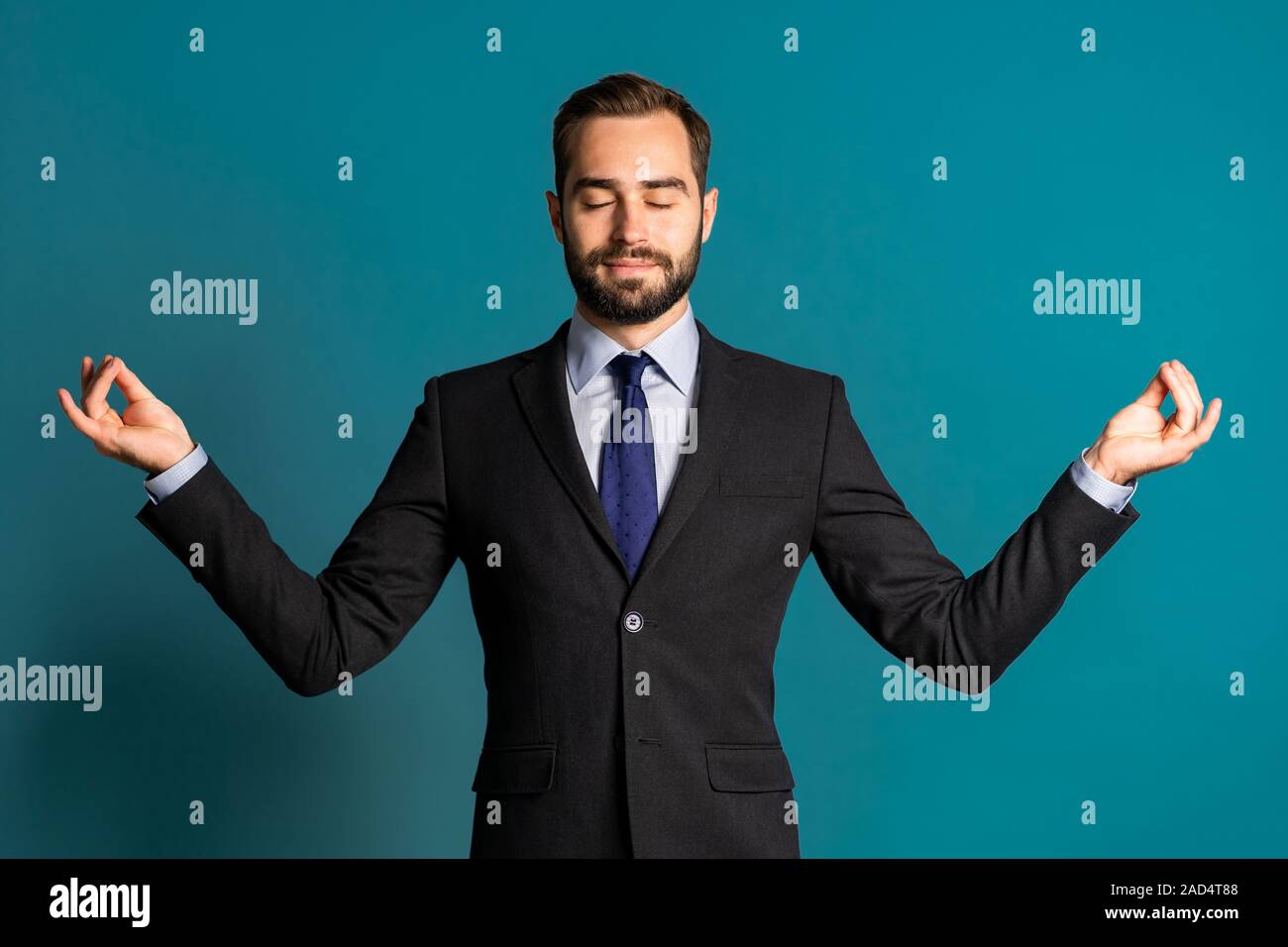 Calm businessman in campaign suit relaxing, meditating. Handsome ...