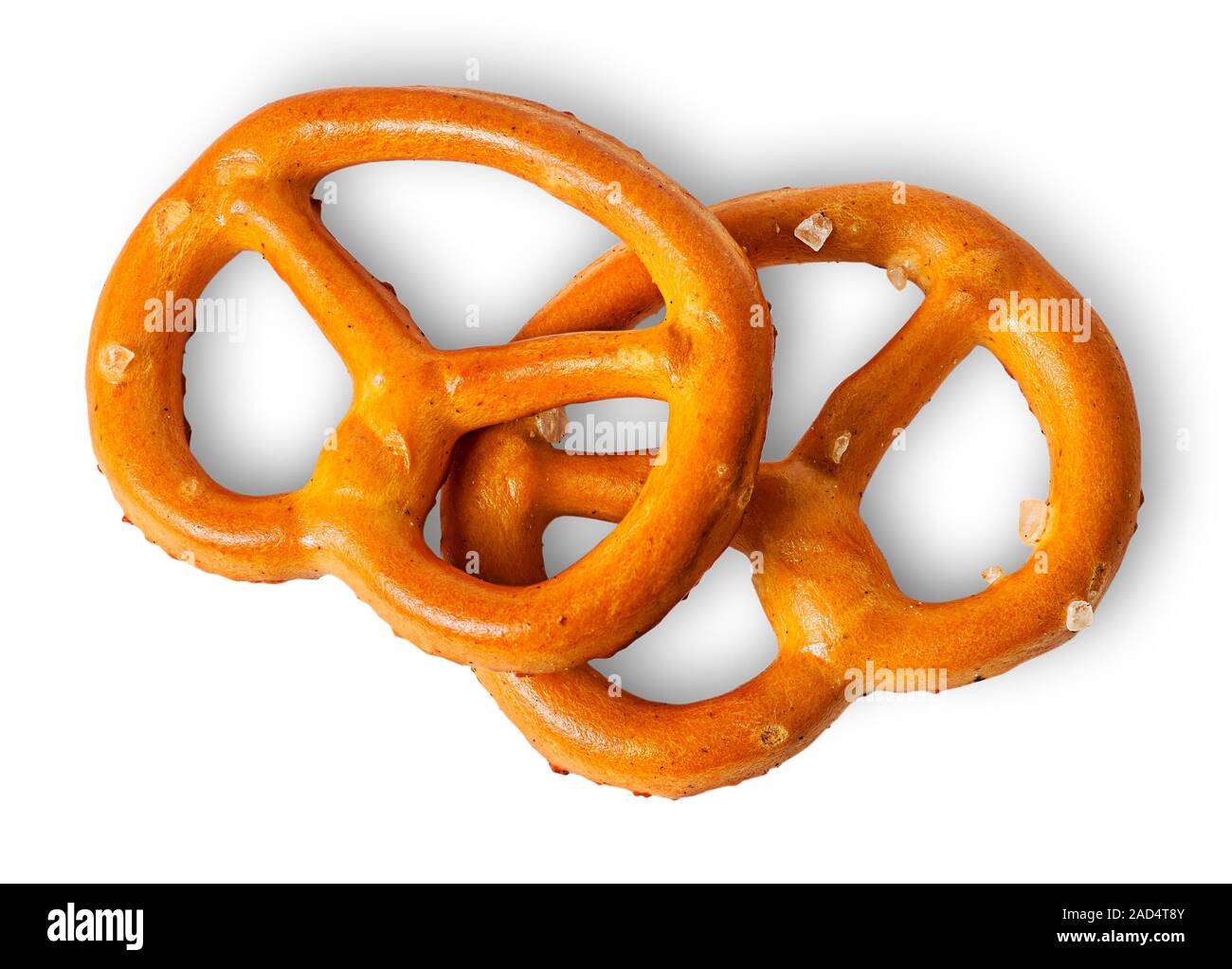 Two crunchy pretzels with salt on each other Stock Photo - Alamy