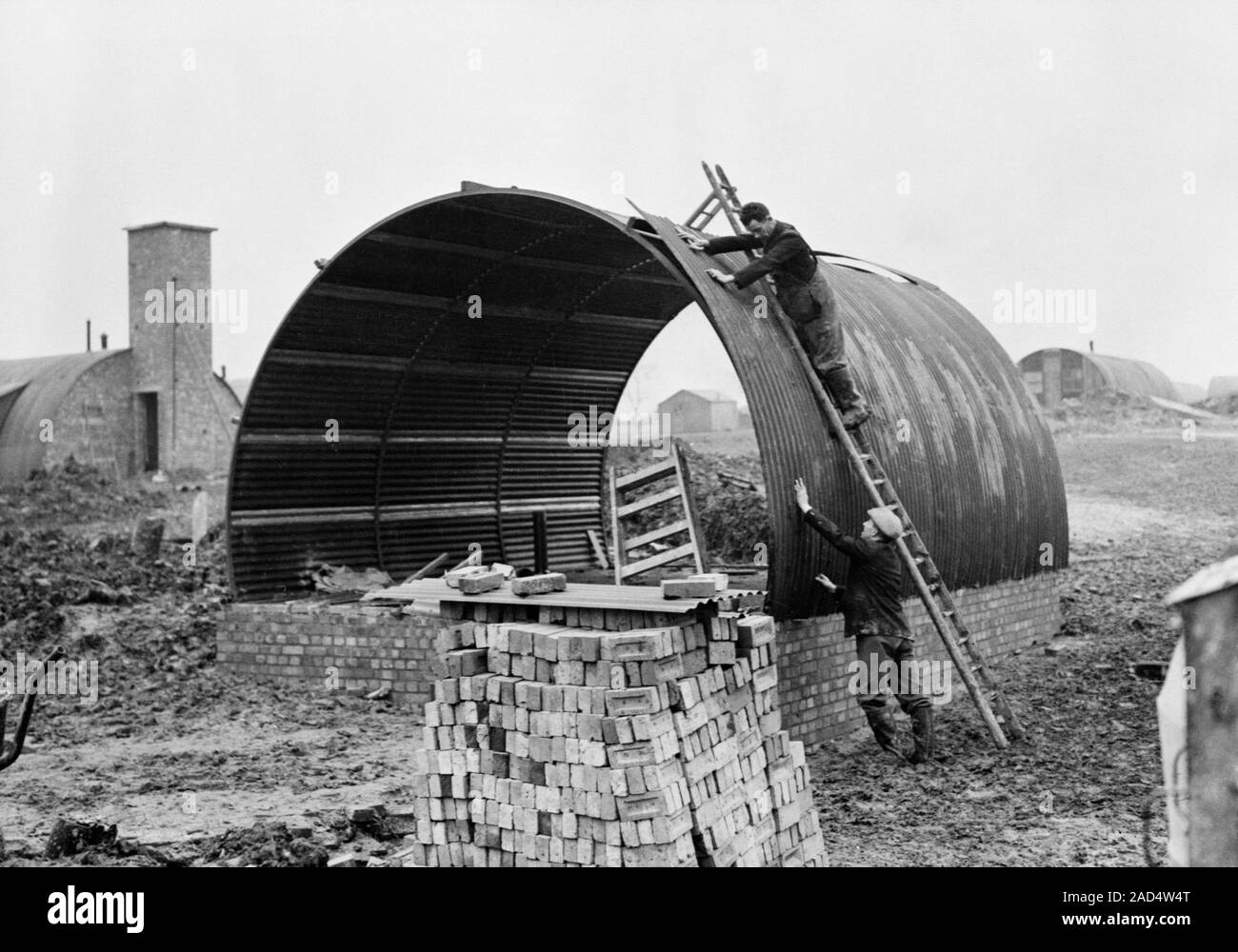 Nissen hut construction. Nissen hut under construction during the ...
