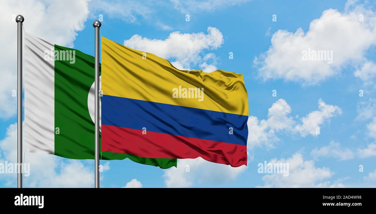 Pakistan and Colombia flag waving in the wind against white cloudy blue ...