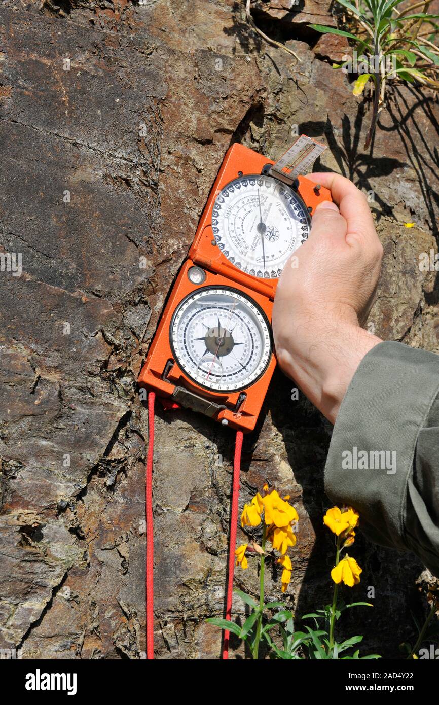 Clinometer and compass. The clinometer (top), also called an ...