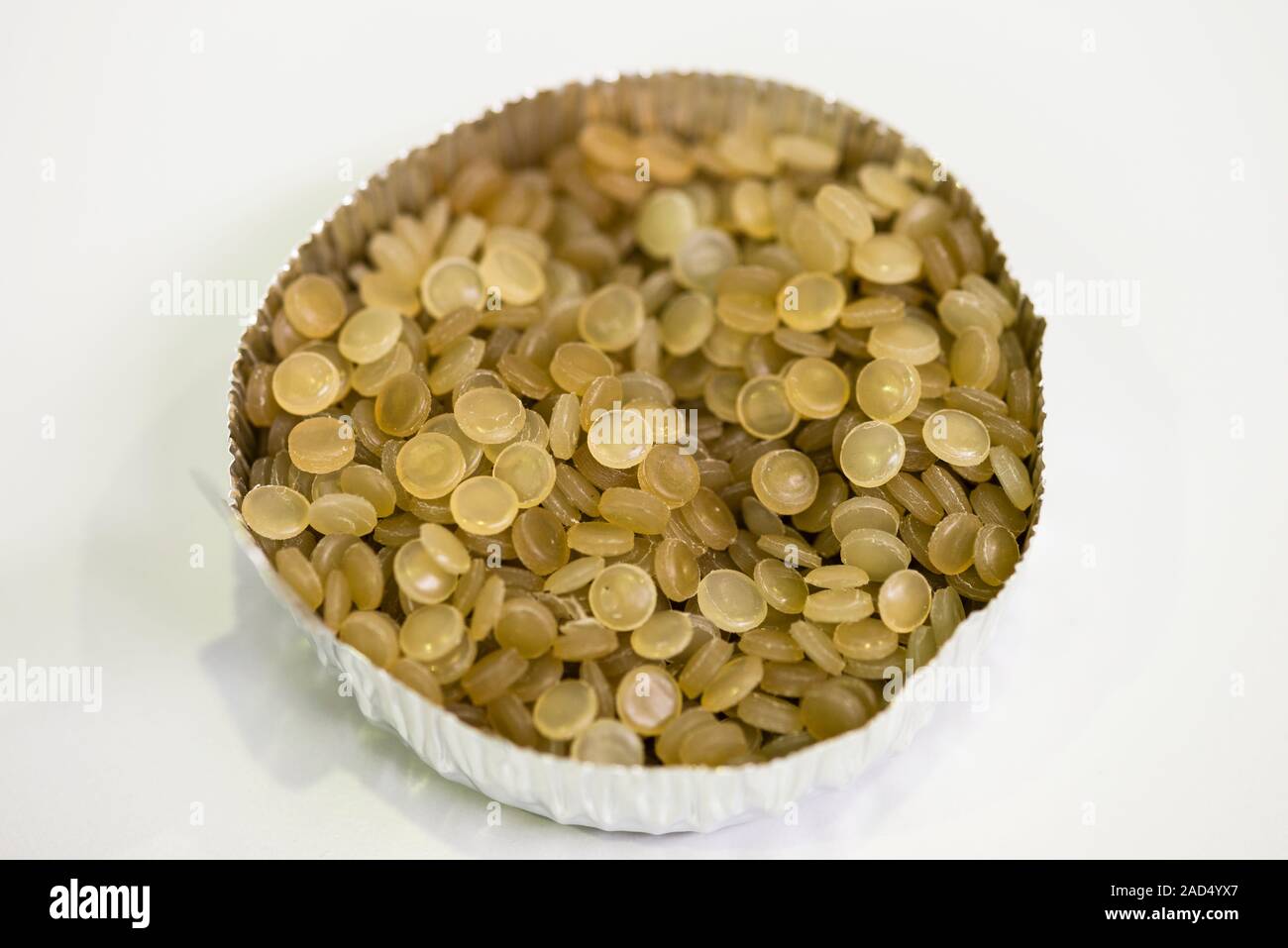 Sample of recycled plastic pellets at a plastics production facility ...