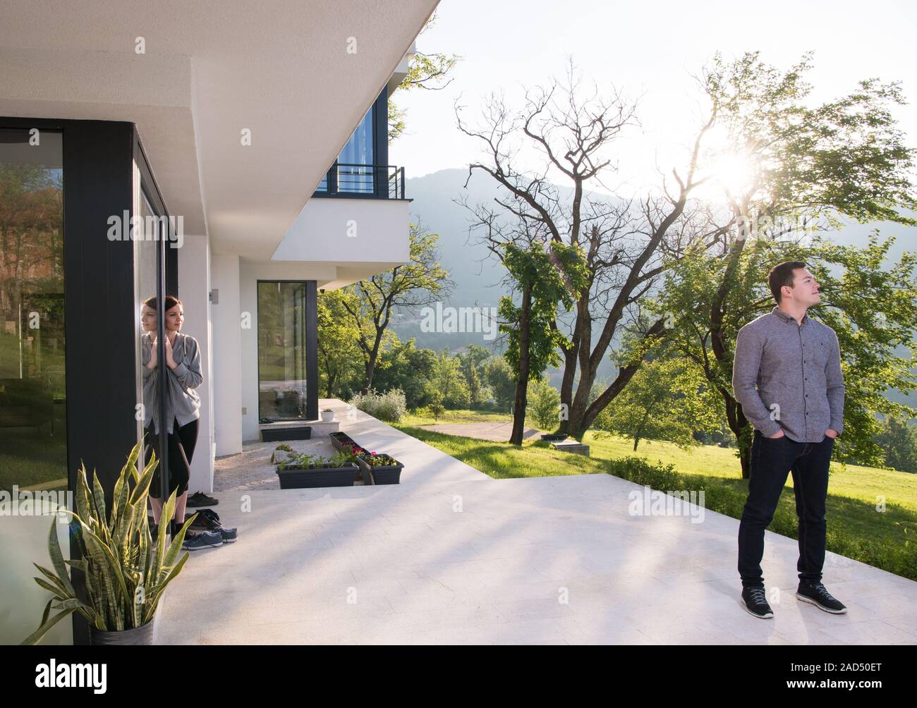 man in front of his luxury home villa Stock Photo - Alamy