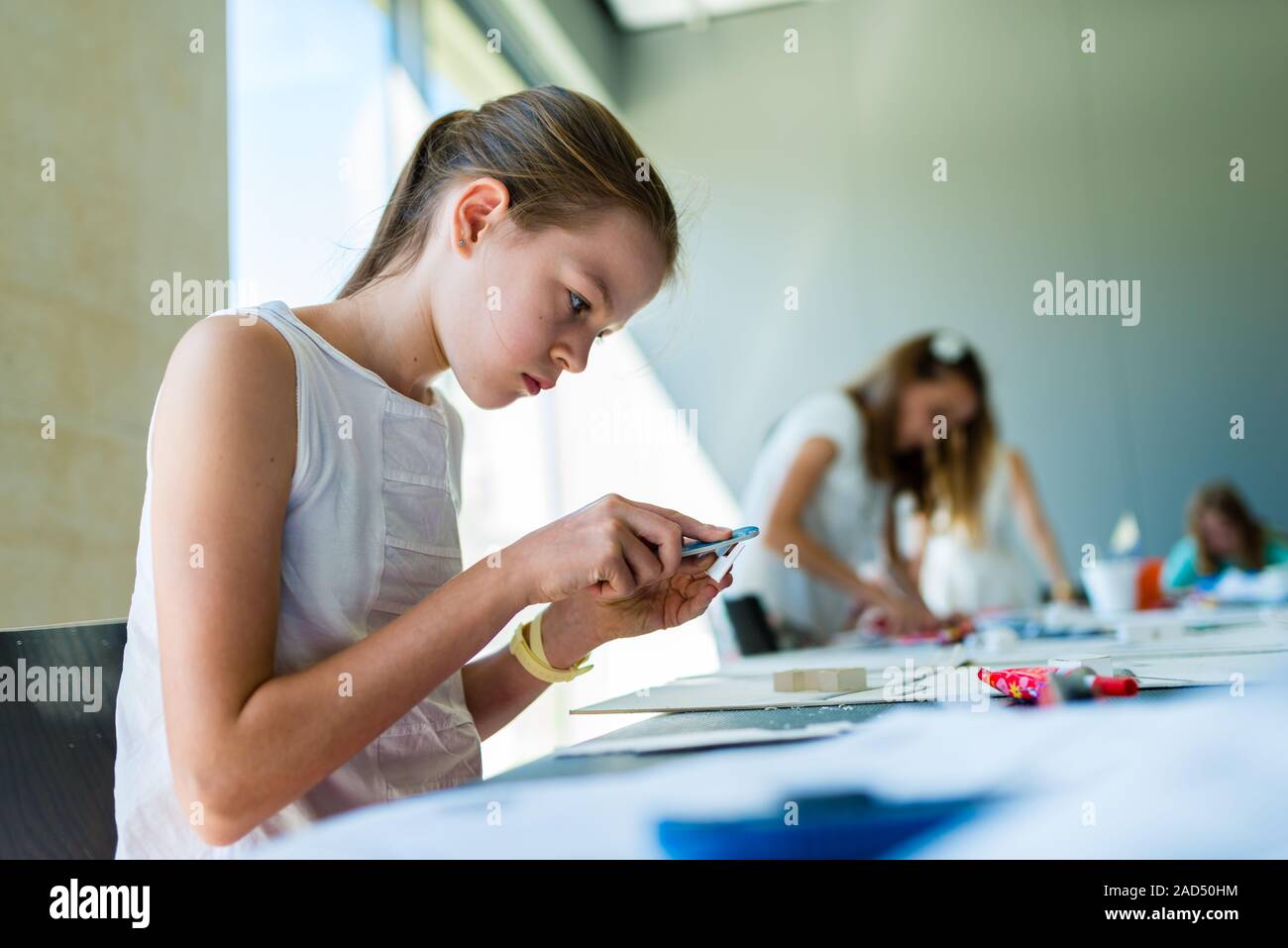 Young girl on the course of architectural design for children ...