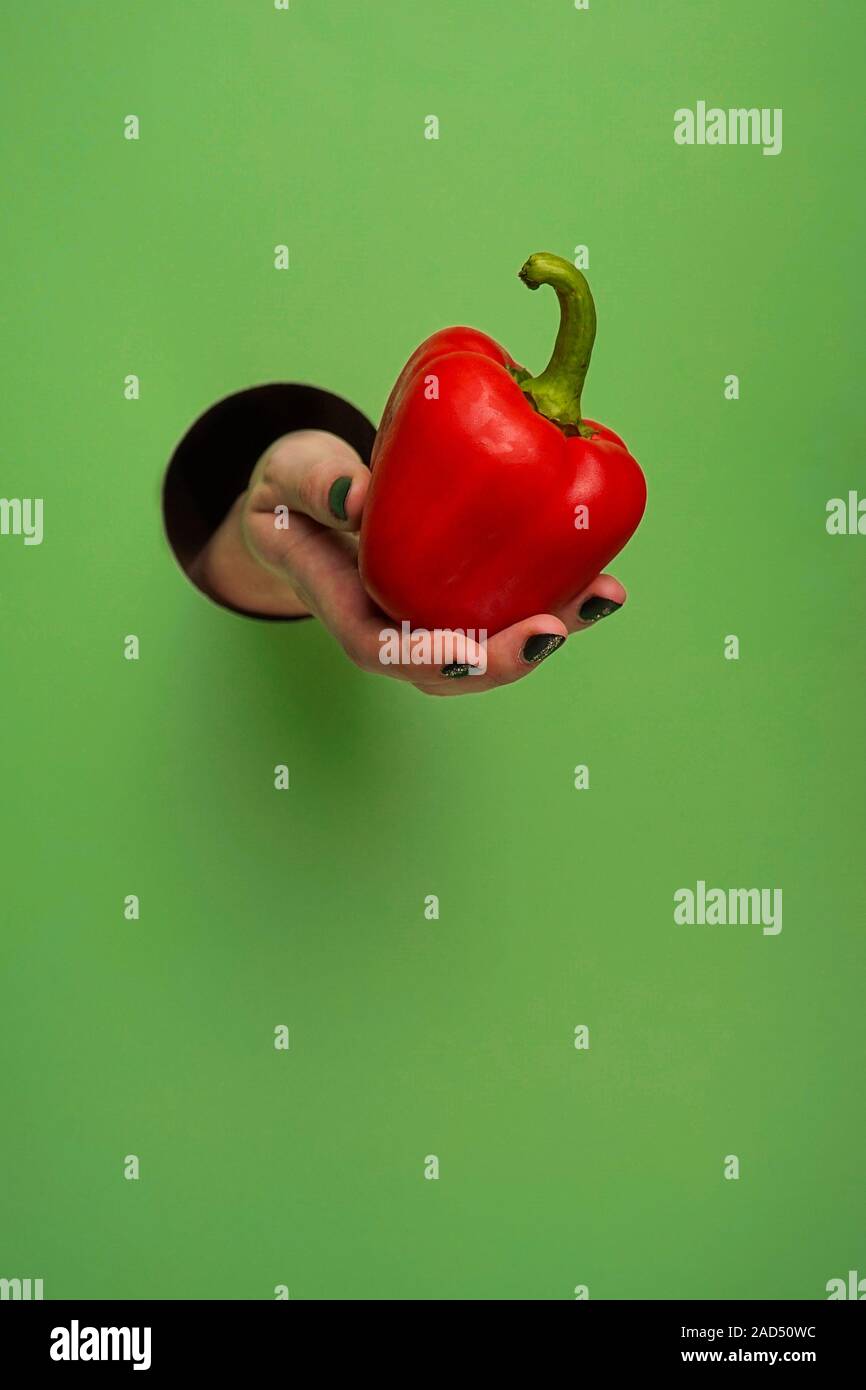 female hand in a circular hole in the background Stock Photo - Alamy