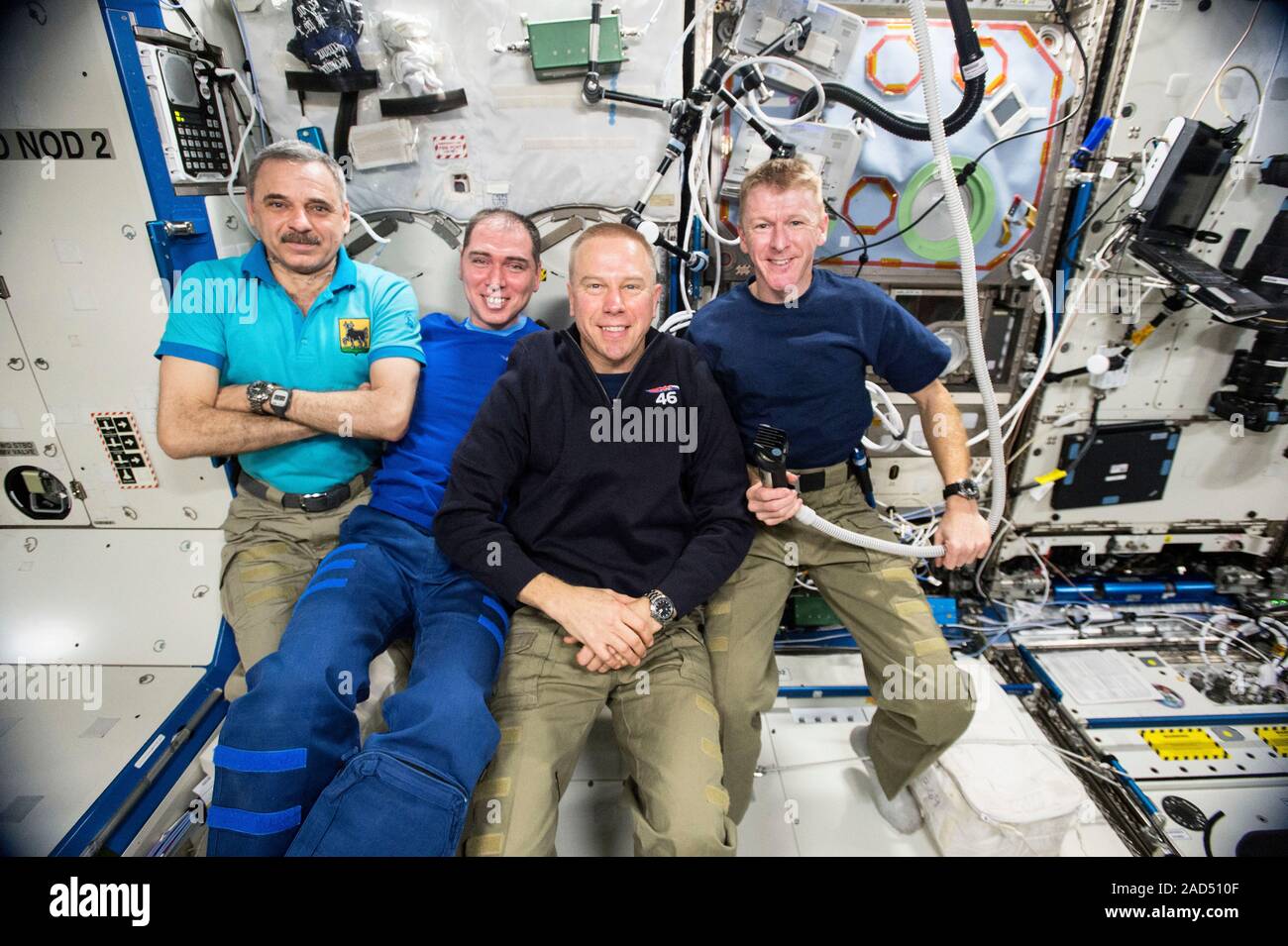 ISS Expedition 46 crew members. Four crew members of Expedition 46 after having their hair cut ...