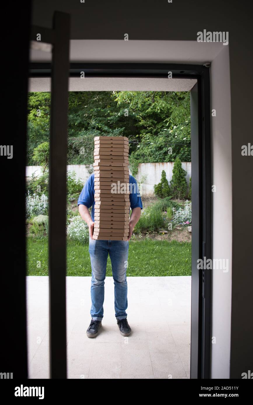 Pizza delivery guy standing door hi-res stock photography and images ...