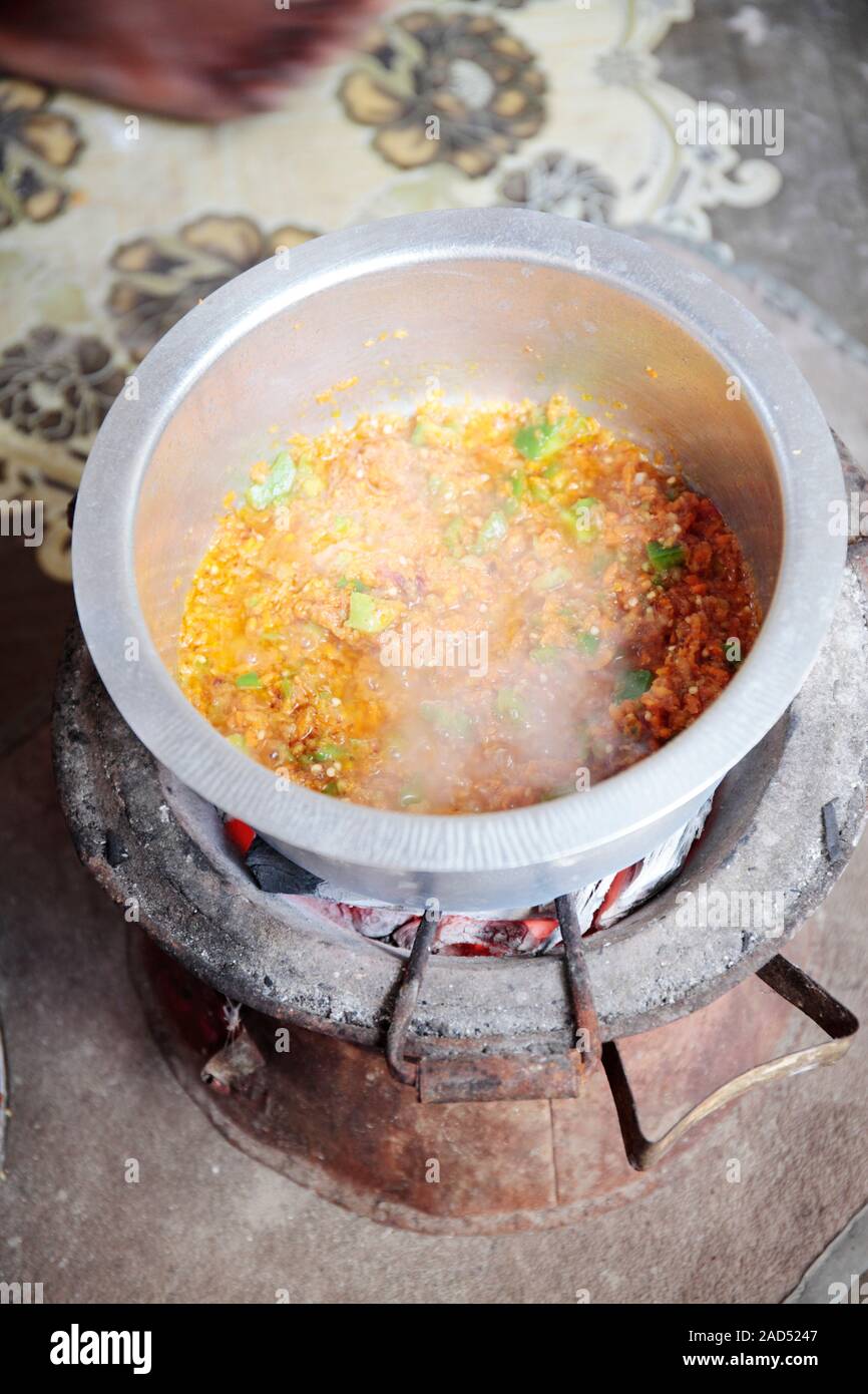 Traditional brazier for cooking. Close-up of a traditional coal-burning ...