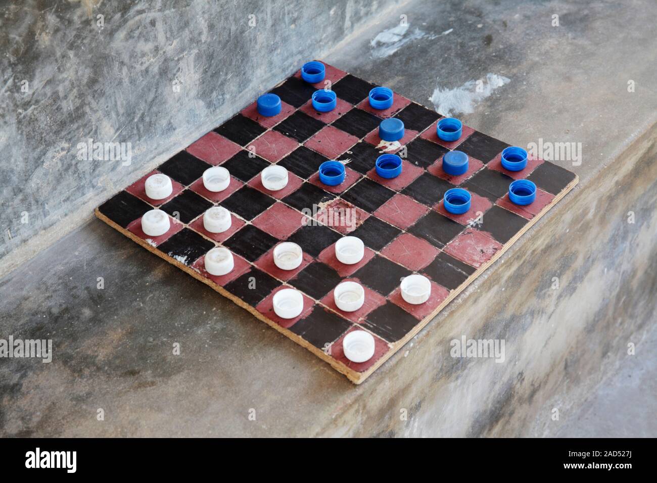 Homemade draughts board. Draughts (checkers) board made from recycled ...