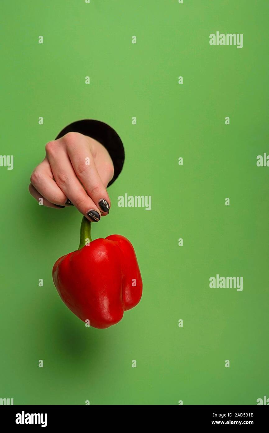 female hand in a circular hole in the background Stock Photo - Alamy