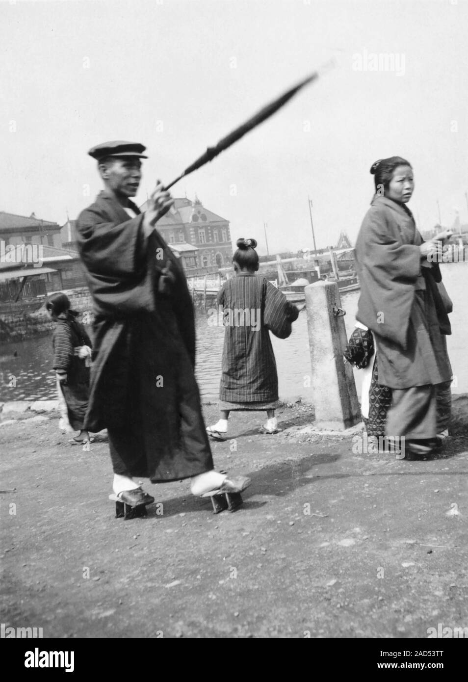 Japanese man and woman wearing geta on their feet, as photographed by ...