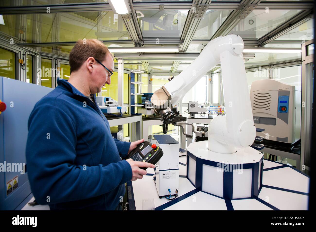 Phenotypic screening laboratory robot. Researcher with a modular ...