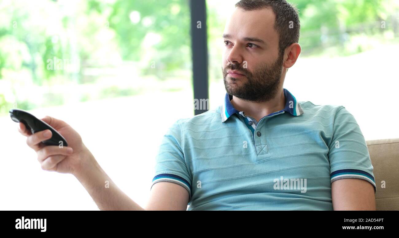 Happy Man Watching Television Stock Photo - Alamy