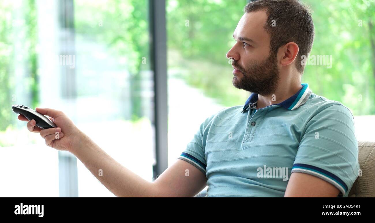 Happy Man Watching Television Stock Photo - Alamy