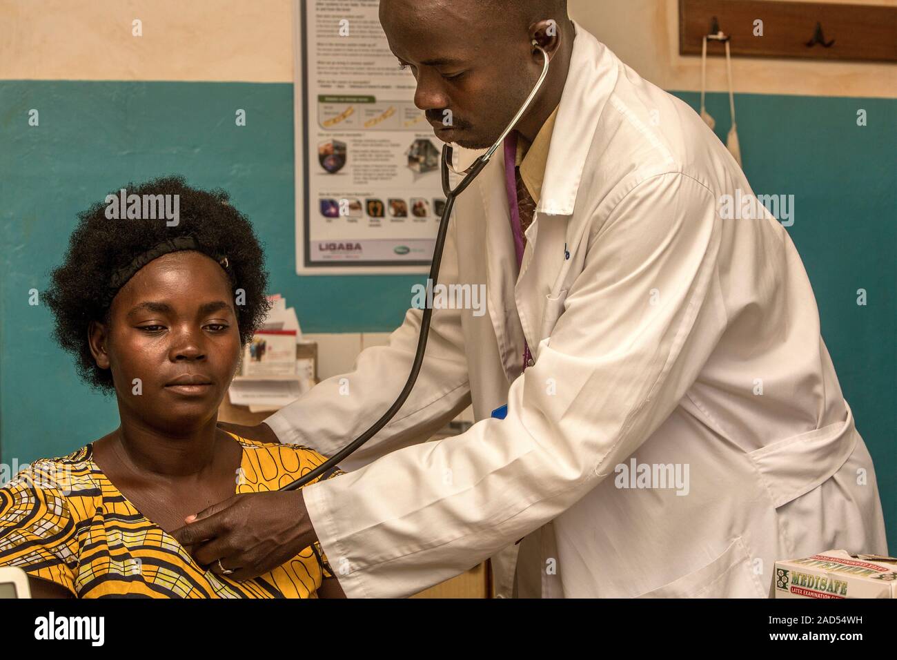 Hospital examination. Hospital doctor examining a patient with a ...