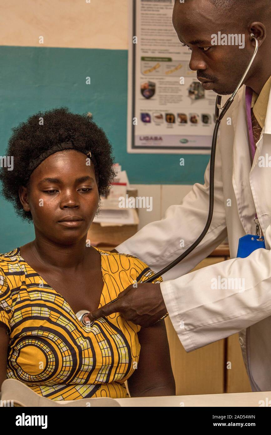 Hospital examination. Hospital doctor examining a patient with a ...