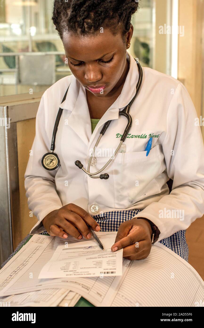 Hospital doctor reading notes. Photographed in St Mary's Hospital ...