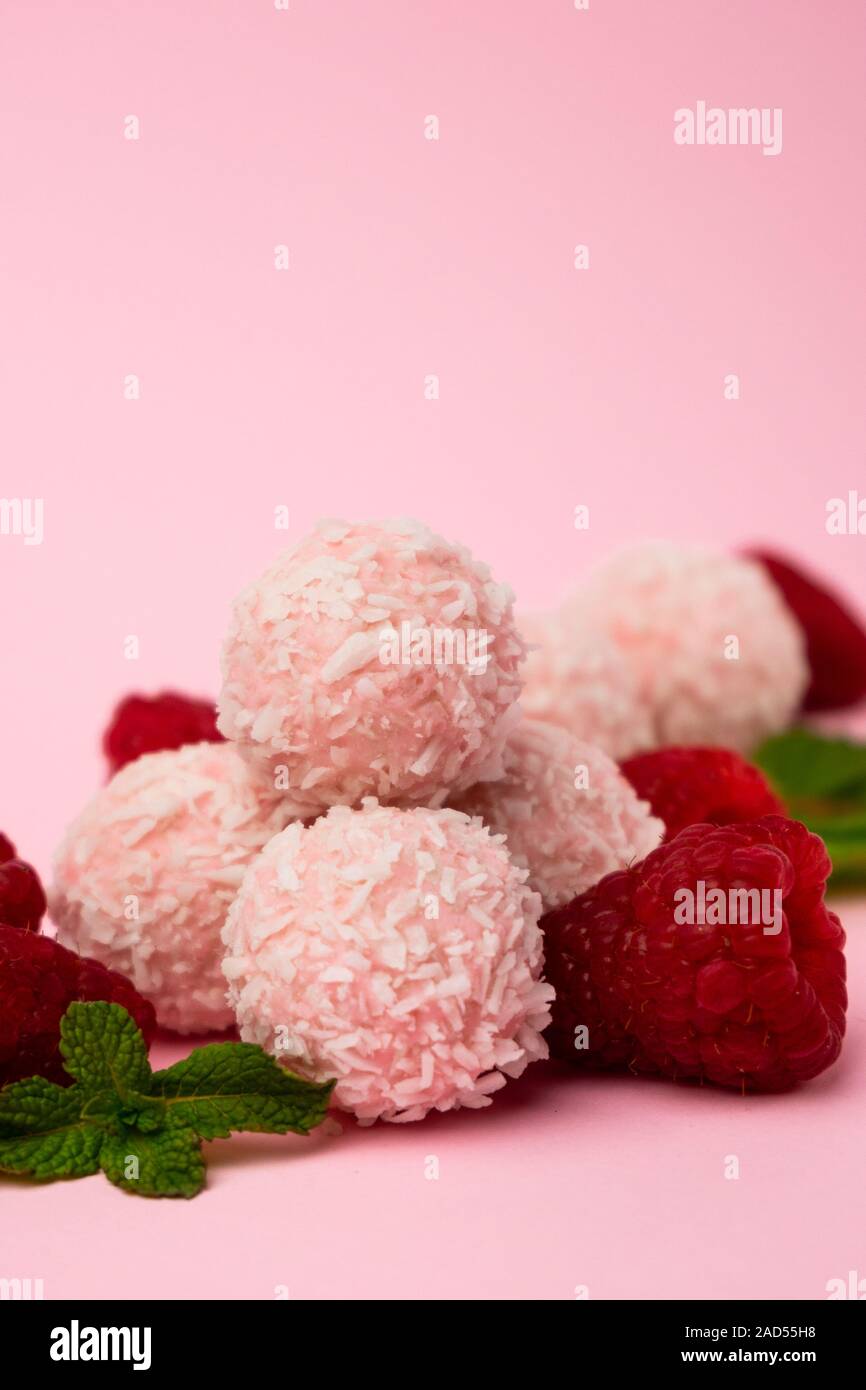 pink coconut candy with raspberries Stock Photo - Alamy