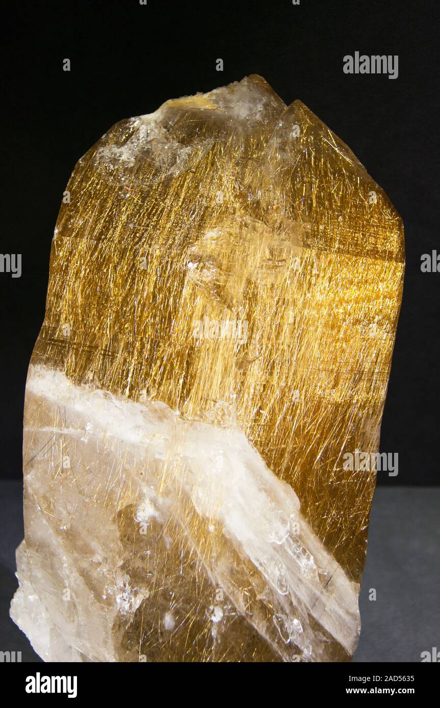 A sample of golden needles of Rutile (TiO2) in quartz crystal (SiO2 ...