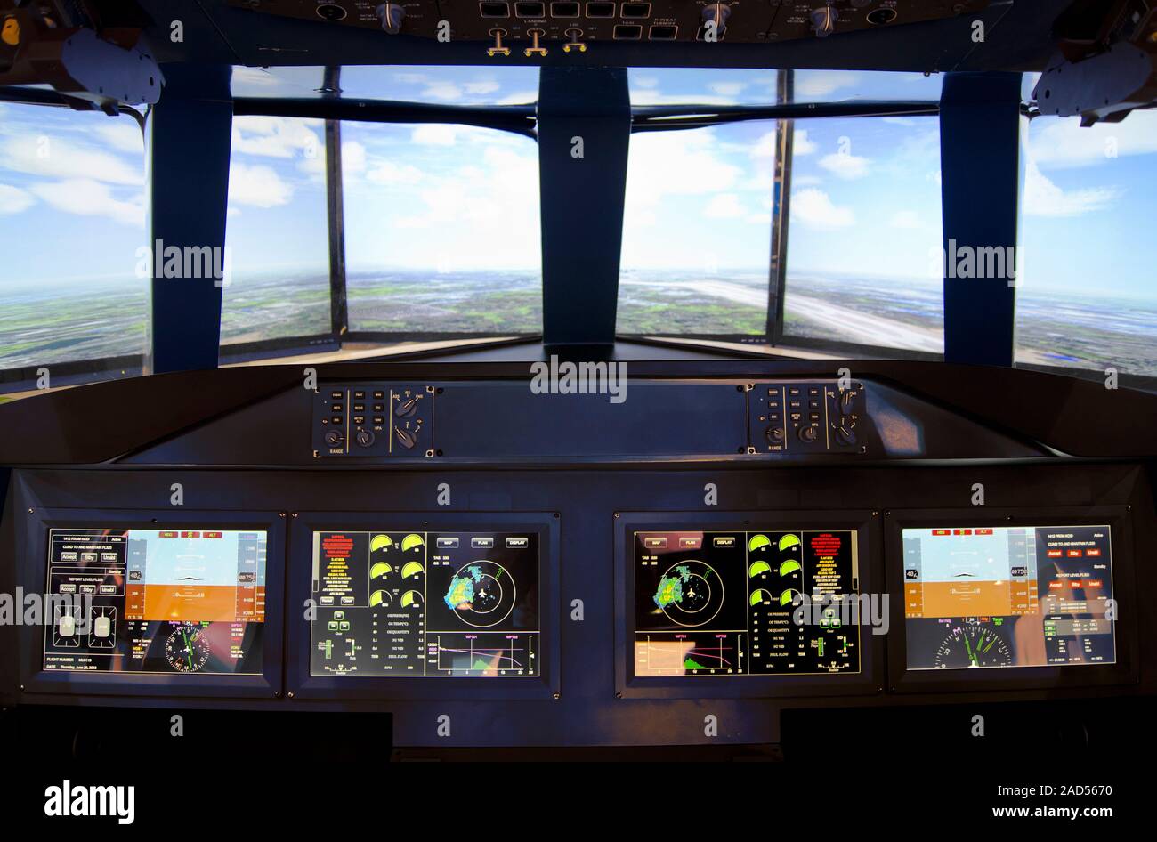 An aircraft flight simulator showing display screens and a simulated ...