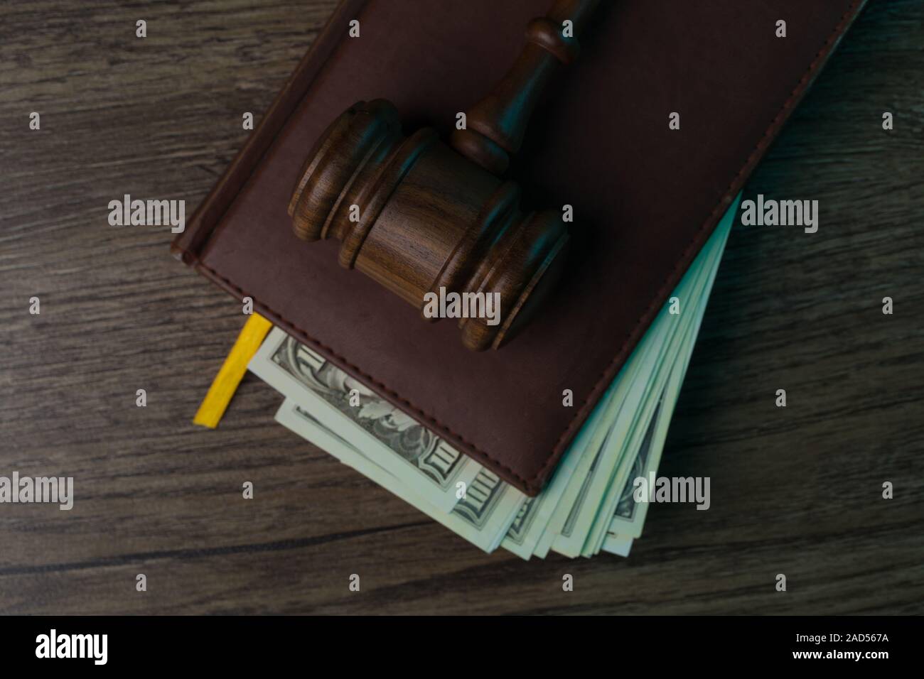 Judge's hammer, folder with banknotes Stock Photo - Alamy