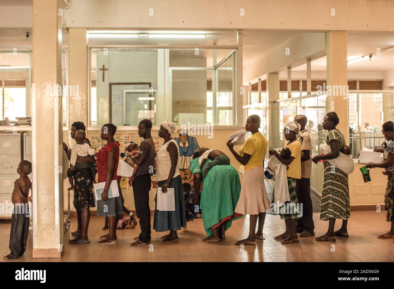 Hospital pharmacy queue. Hospital patients and relatives queuing to ...