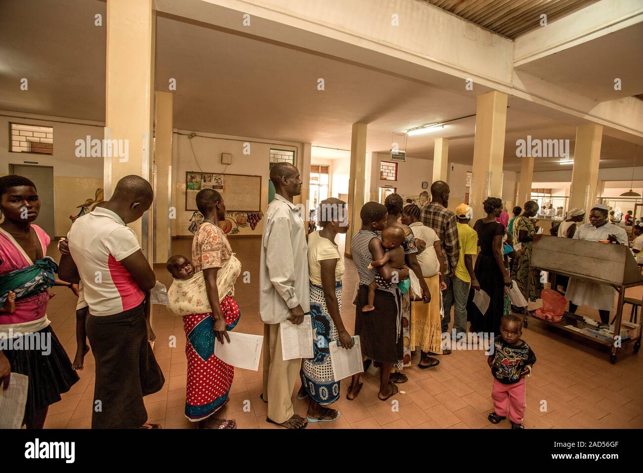 Hospital pharmacy. Hospital patients and relatives queuing to collect ...