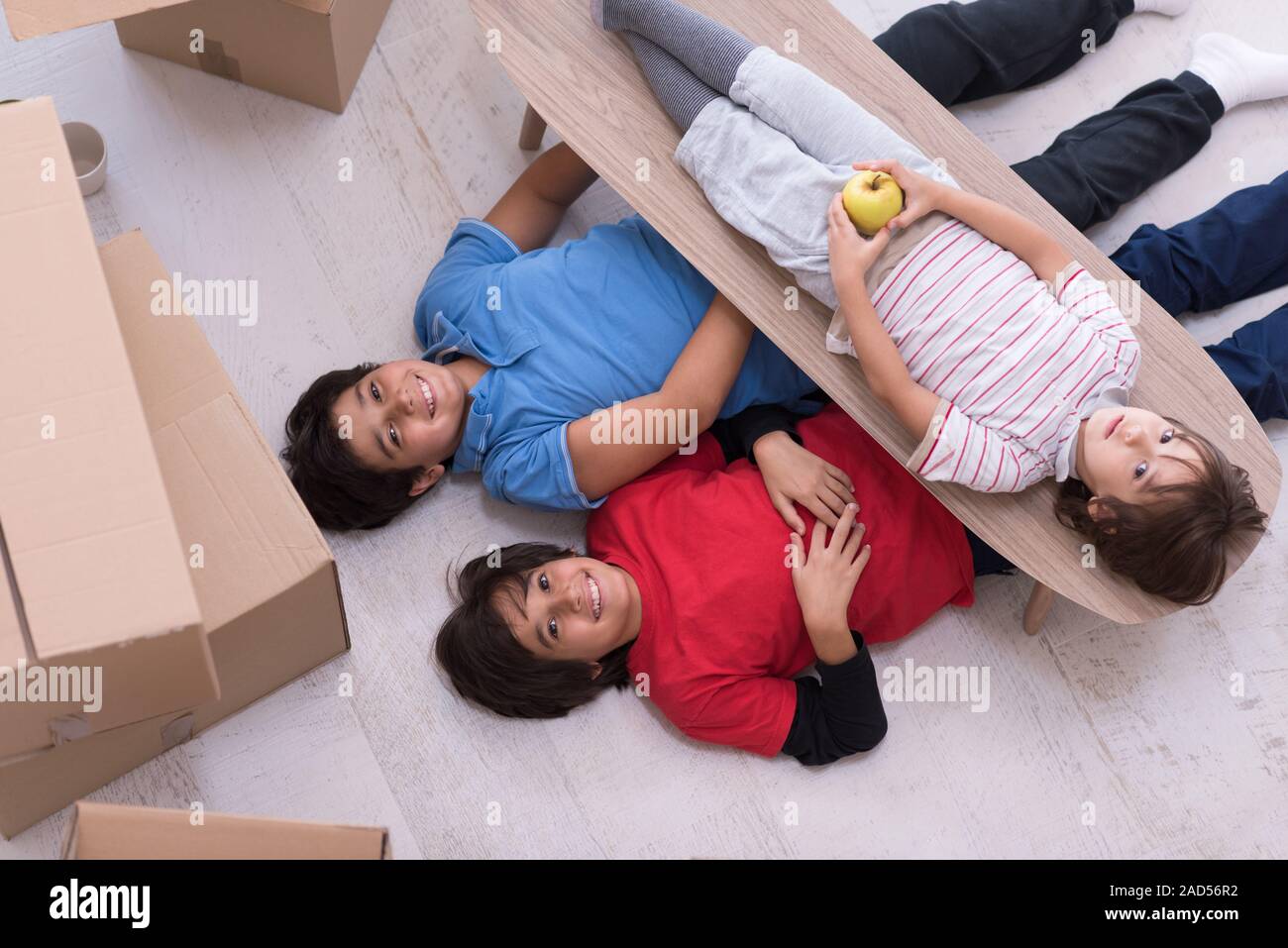 boys with cardboard boxes around them top view Stock Photo - Alamy