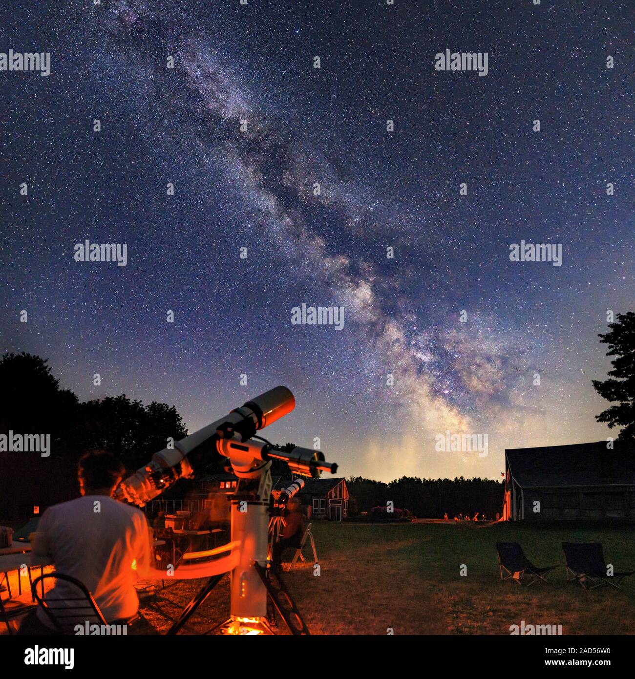 Stargazing. Man observing the night sky through a large telescope Stock ...