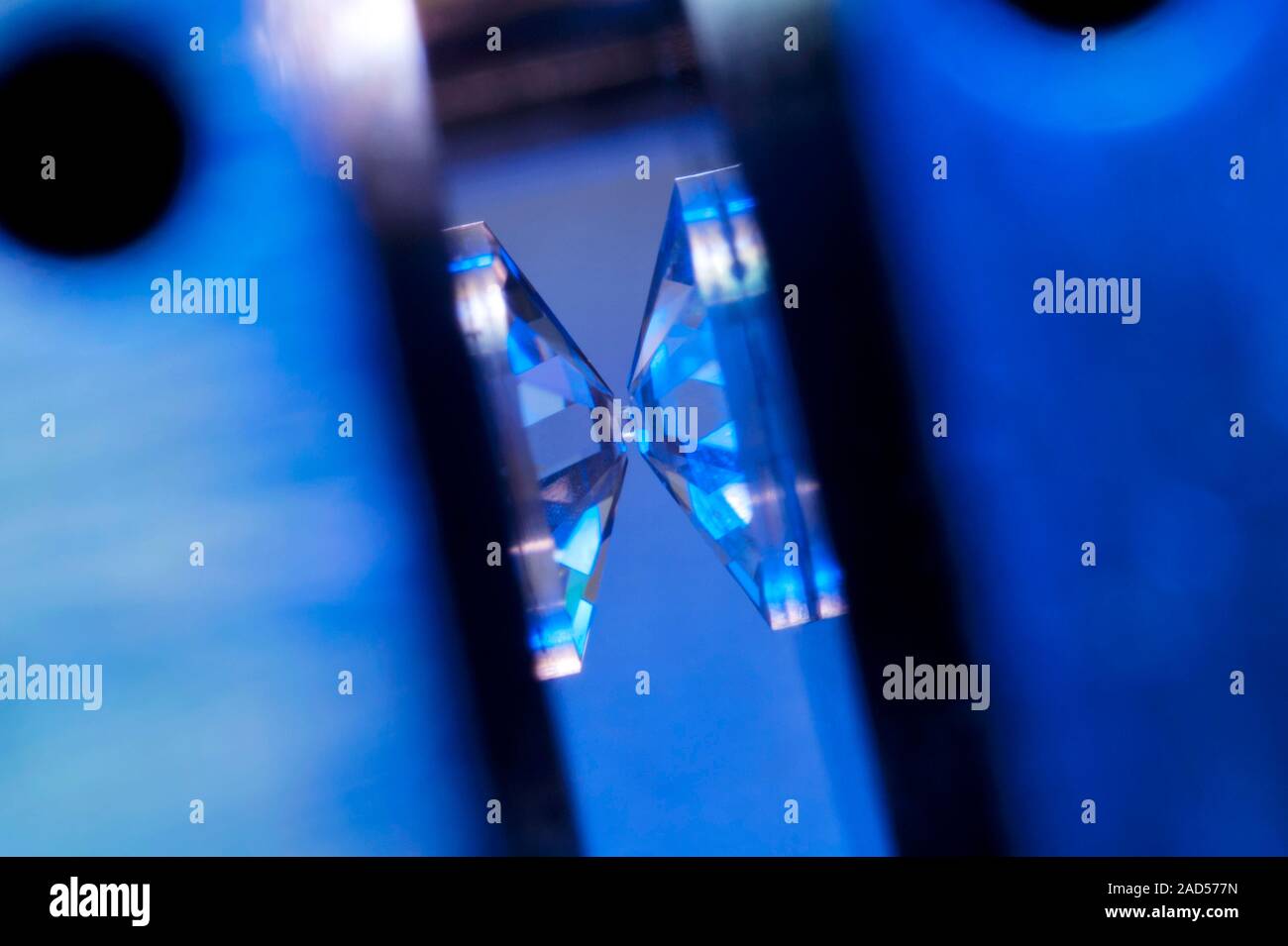 Diamond anvil cell. A crystal is placed under high pressure between two ...