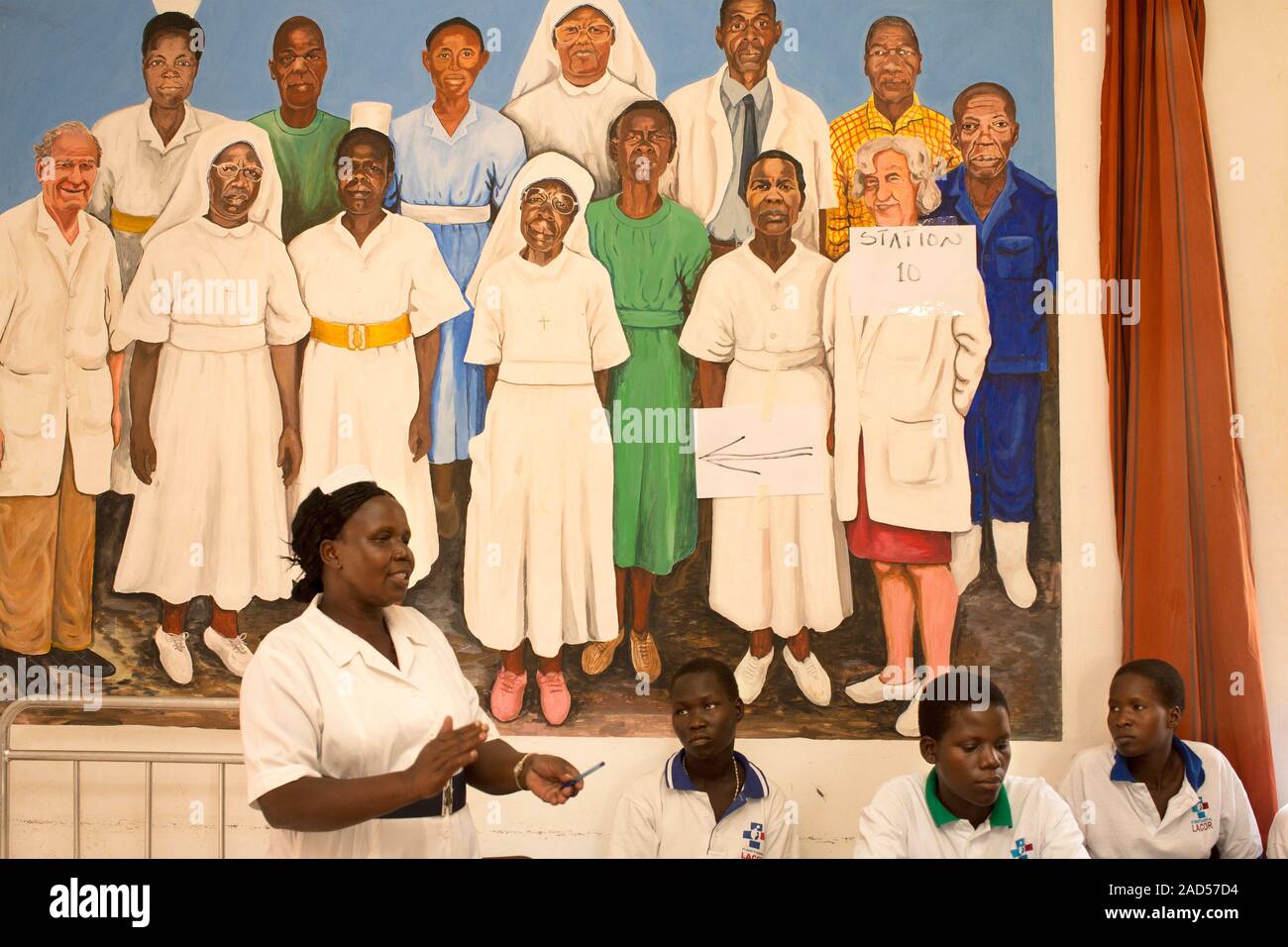 Teacher and students with hospital mural. These students are studying ...