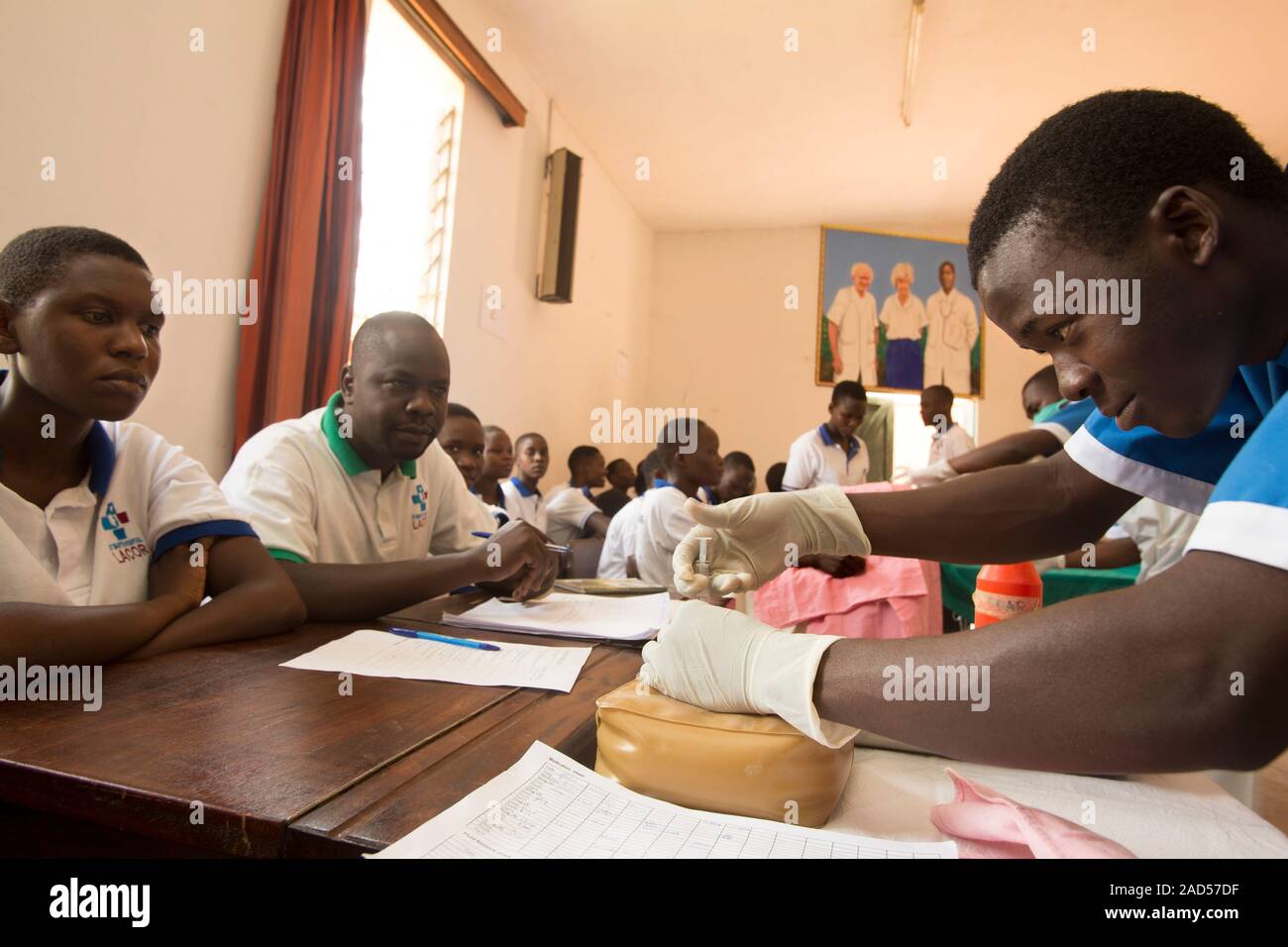 Injection techniques, hospital training. Teacher demonstrating ...