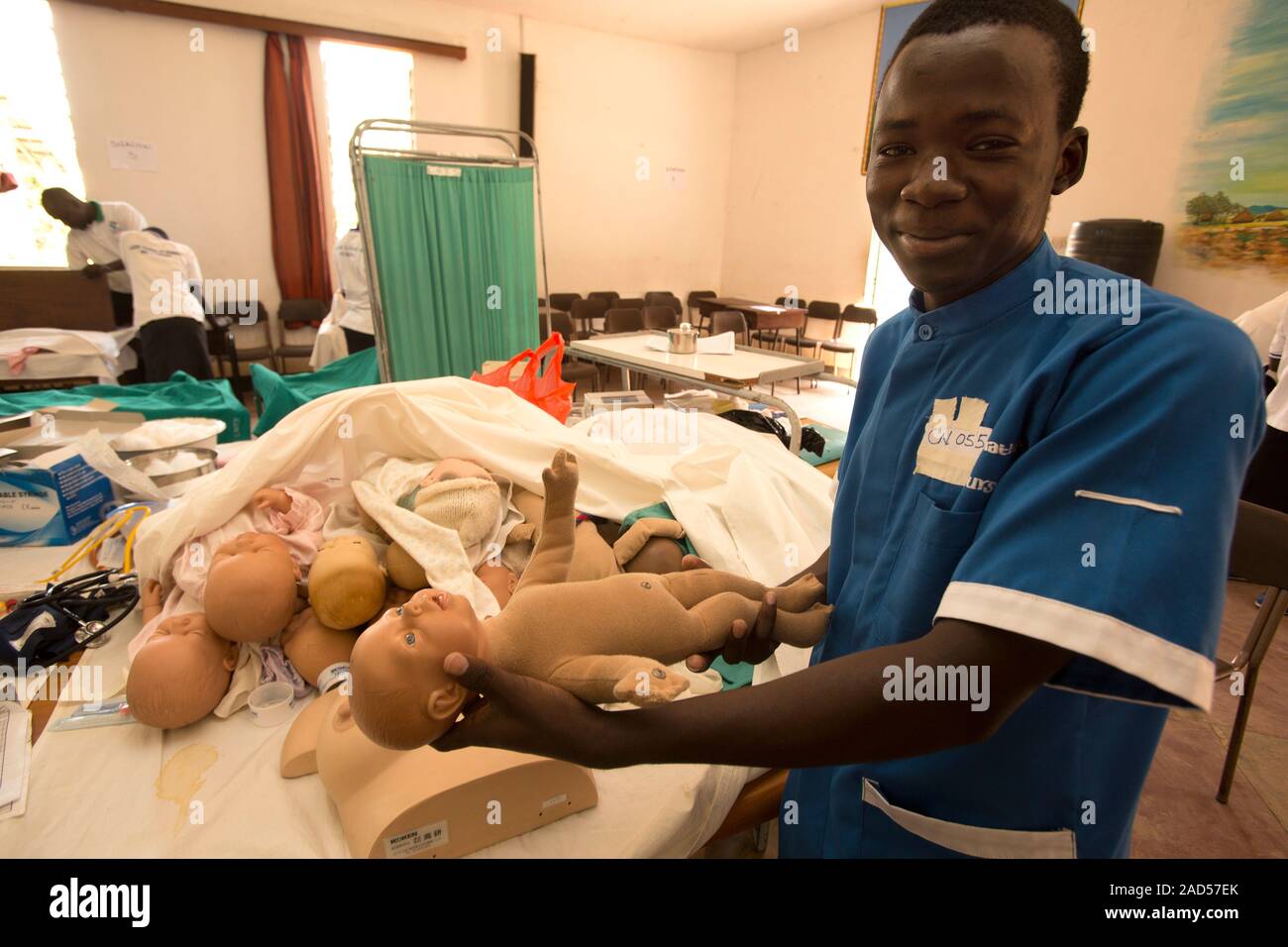 Obstetrics training in a hospital. Nursing instructor handling baby ...