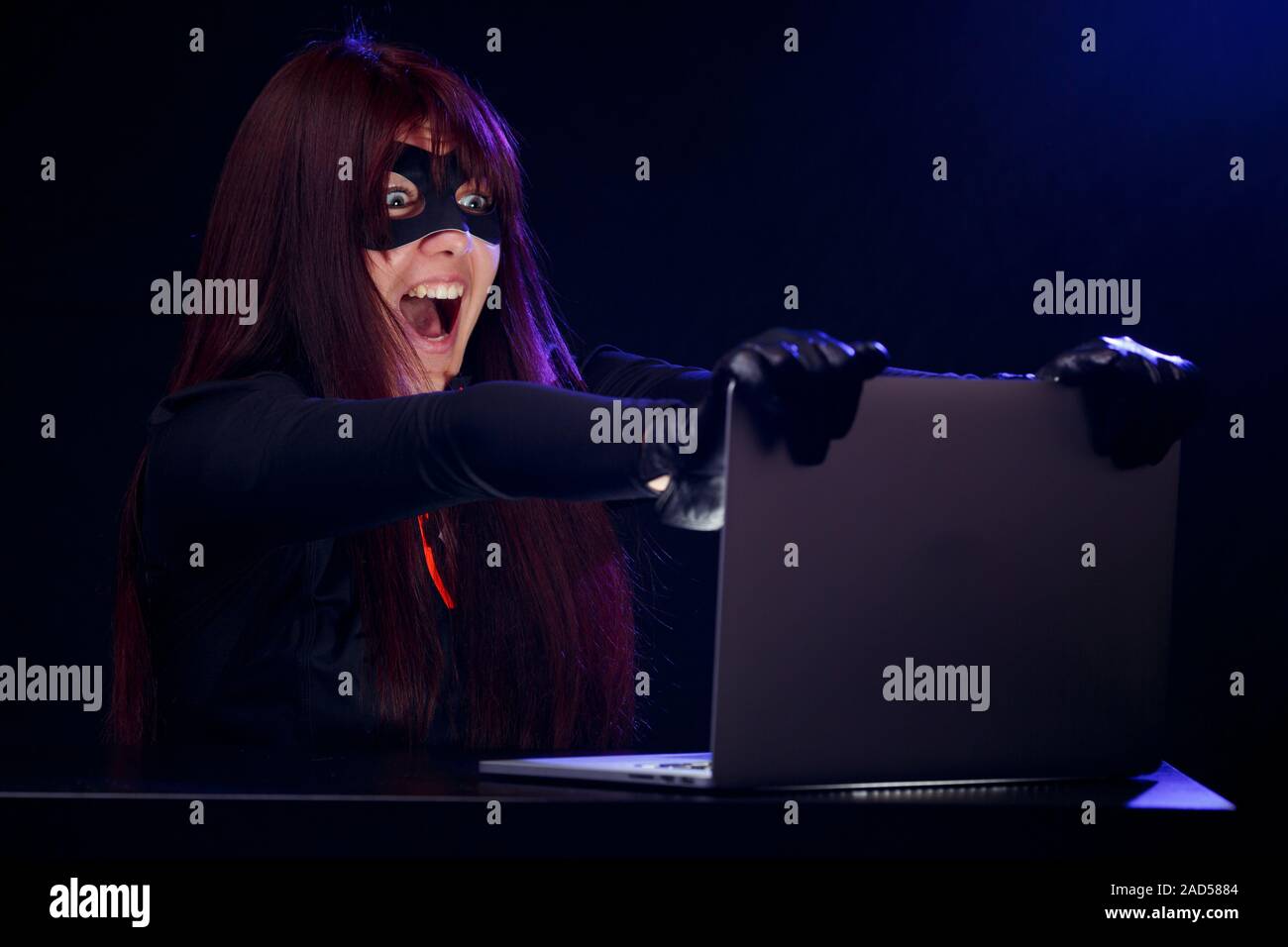 Girl steals information from computer Stock Photo - Alamy