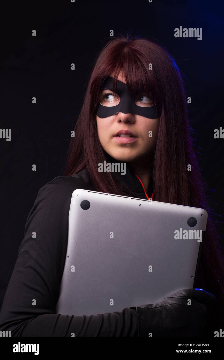 Girl in dark holds hi-res stock photography and images - Alamy