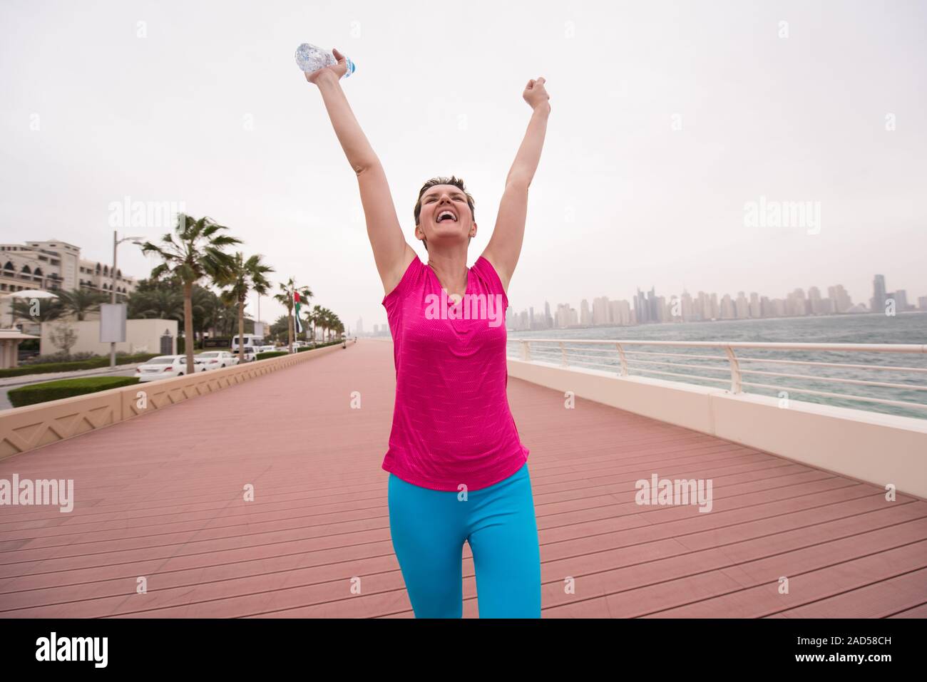 young woman celebrating a successful training run Stock Photo - Alamy