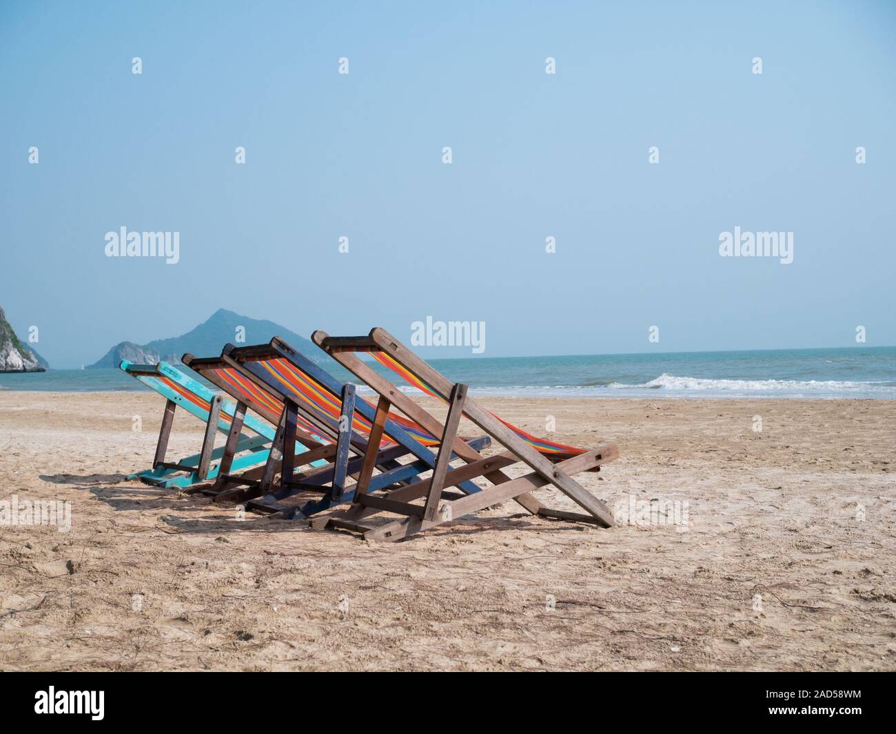 Sandy beach with deck chairs Stock Photo - Alamy